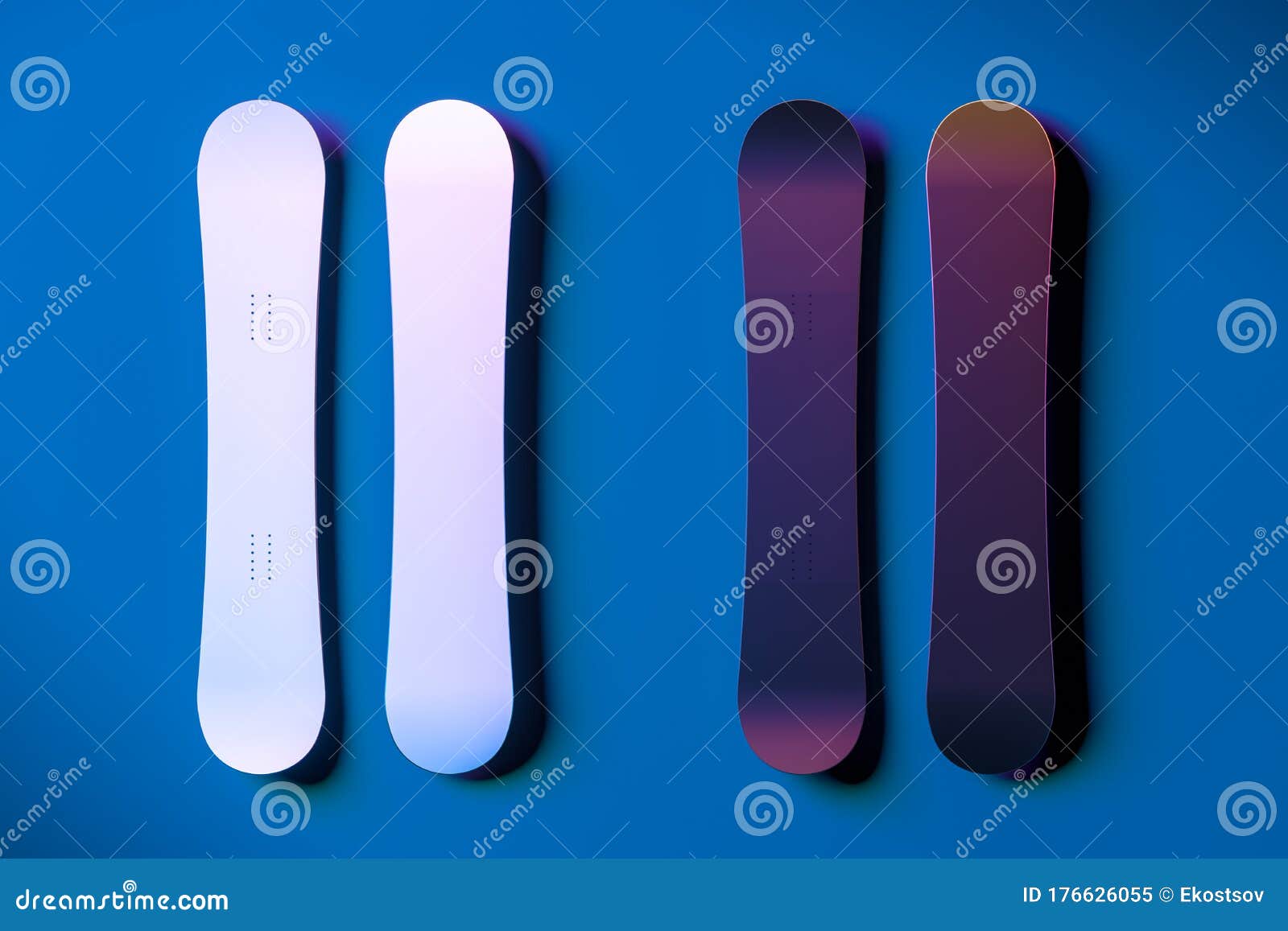 White Blank Snowboard Near Dark Violet and Blue Blank Snowboard on Blue ...