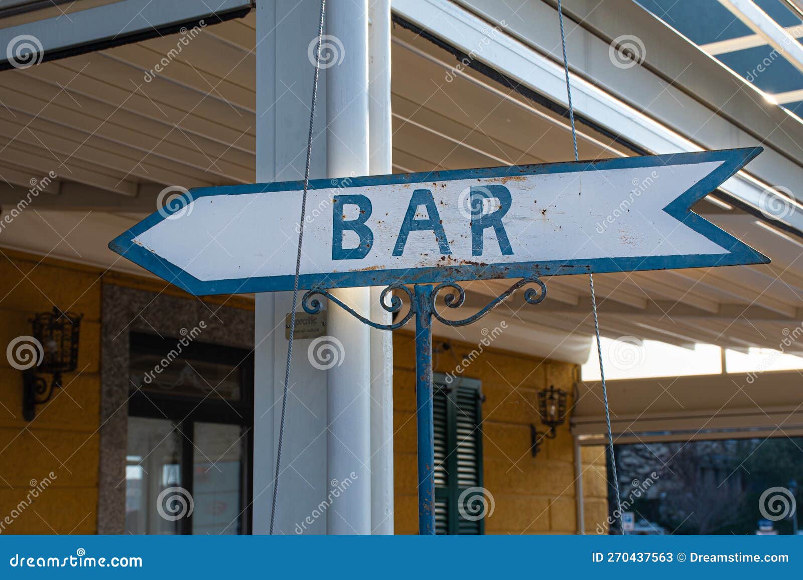 White and Blue Arrow-shaped Sign Indicating Bar Stock Image - Image of ...