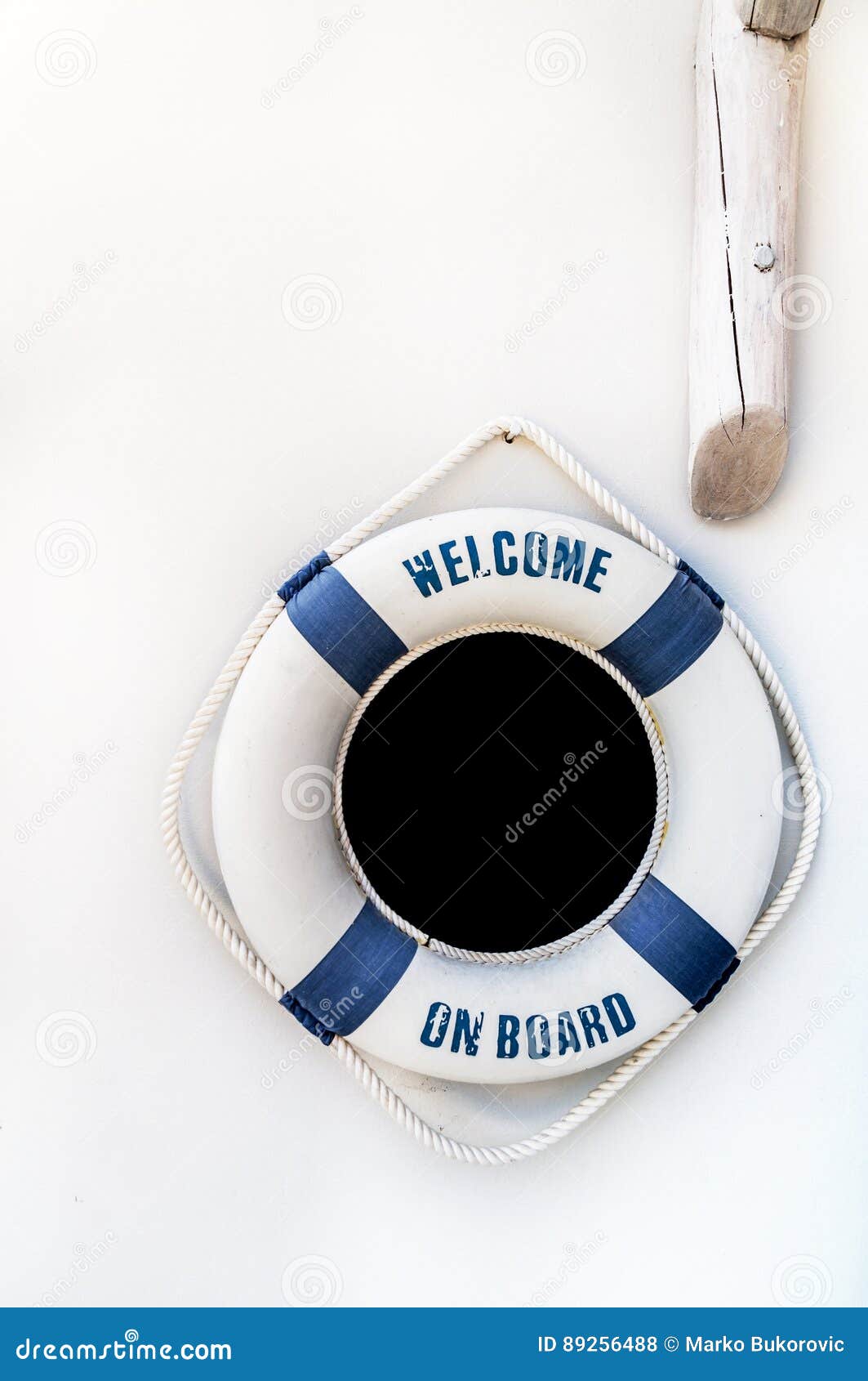 White and Blue Lifebuoy on White Wall, Float on the Wall Stock Photo ...