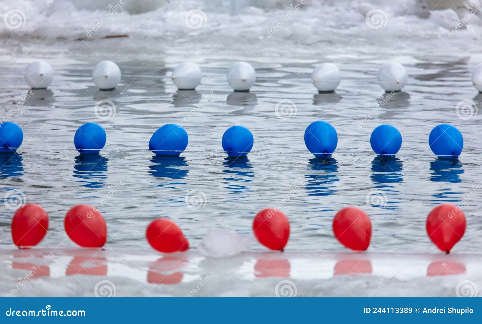 White, Blue and Red Balls Float on the Water Stock Image - Image of ...