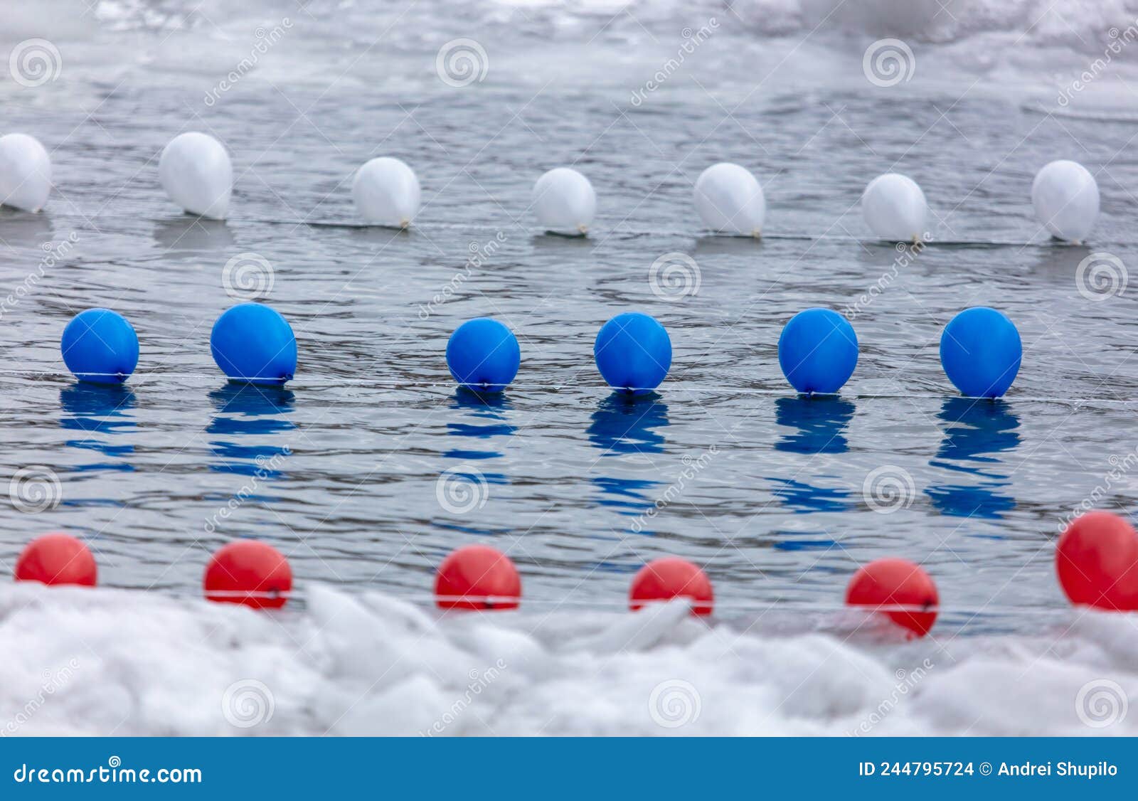 White, Blue and Red Balls Float on the Water Stock Photo - Image of ...