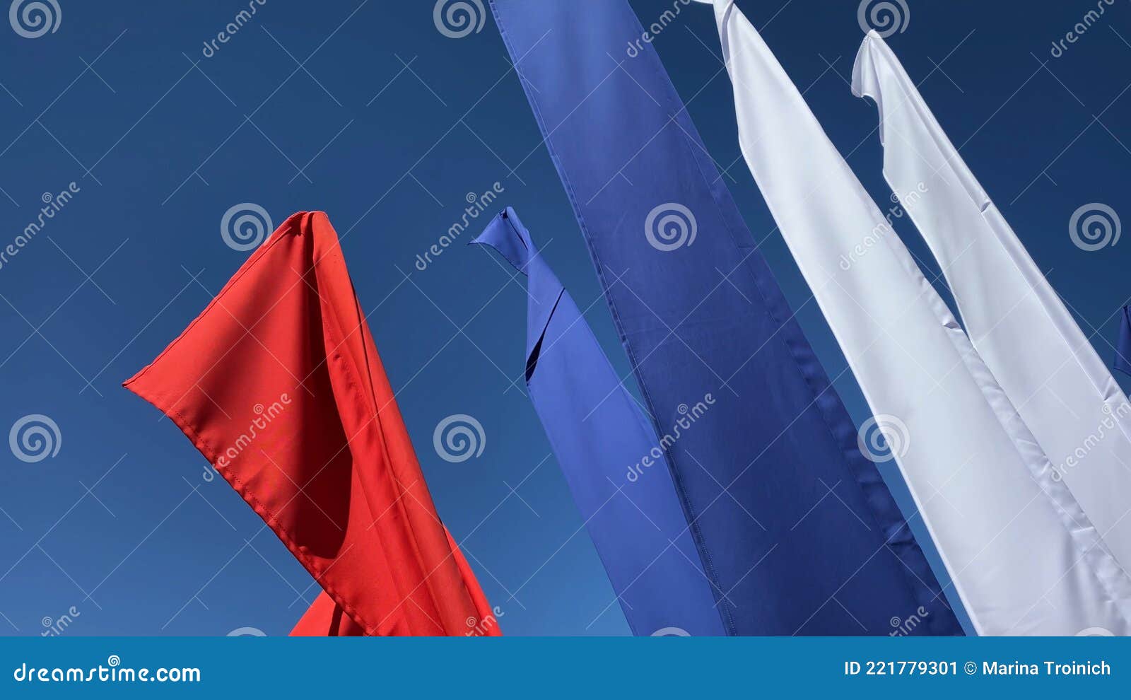 White, Blue and Red Flags Waving in the Wind, Blue Sky Stock Image ...
