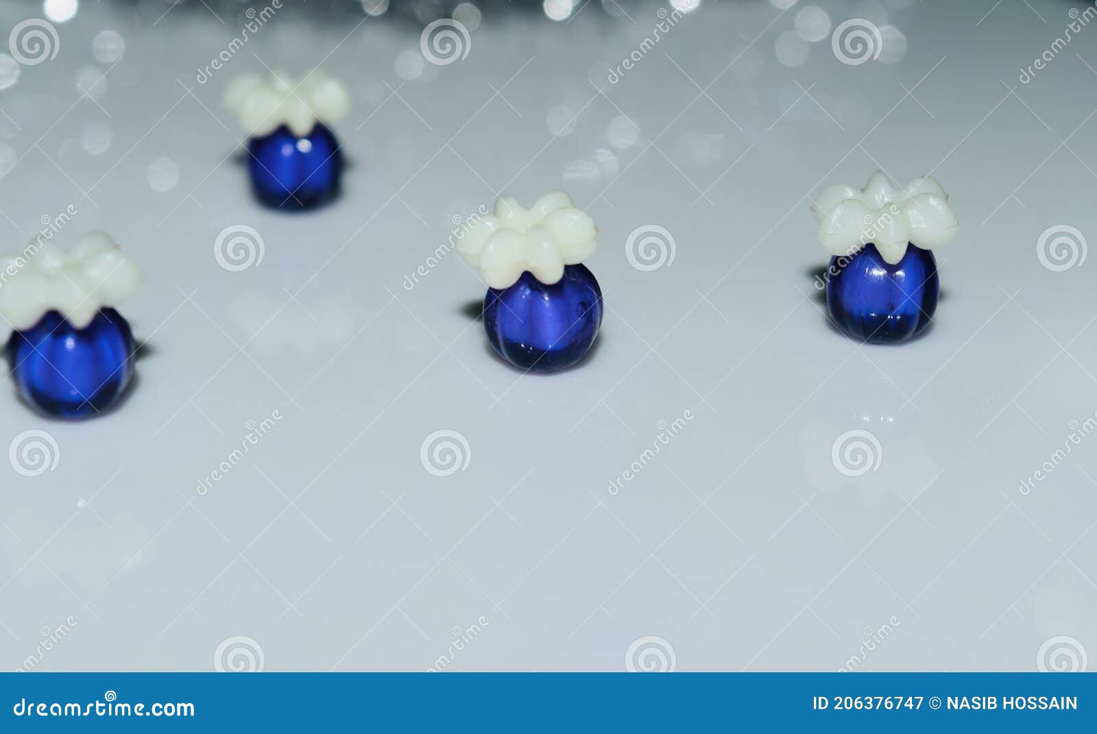 White Blue Small Plastic Objects on a Bright Surface Stock Image ...