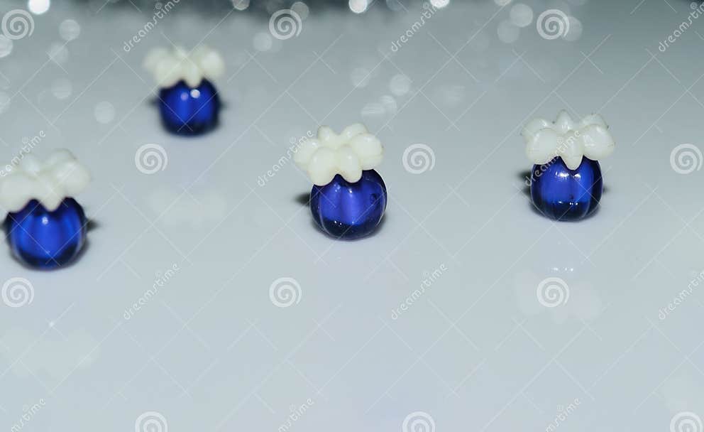 White Blue Small Plastic Objects on a Bright Surface Stock Image ...