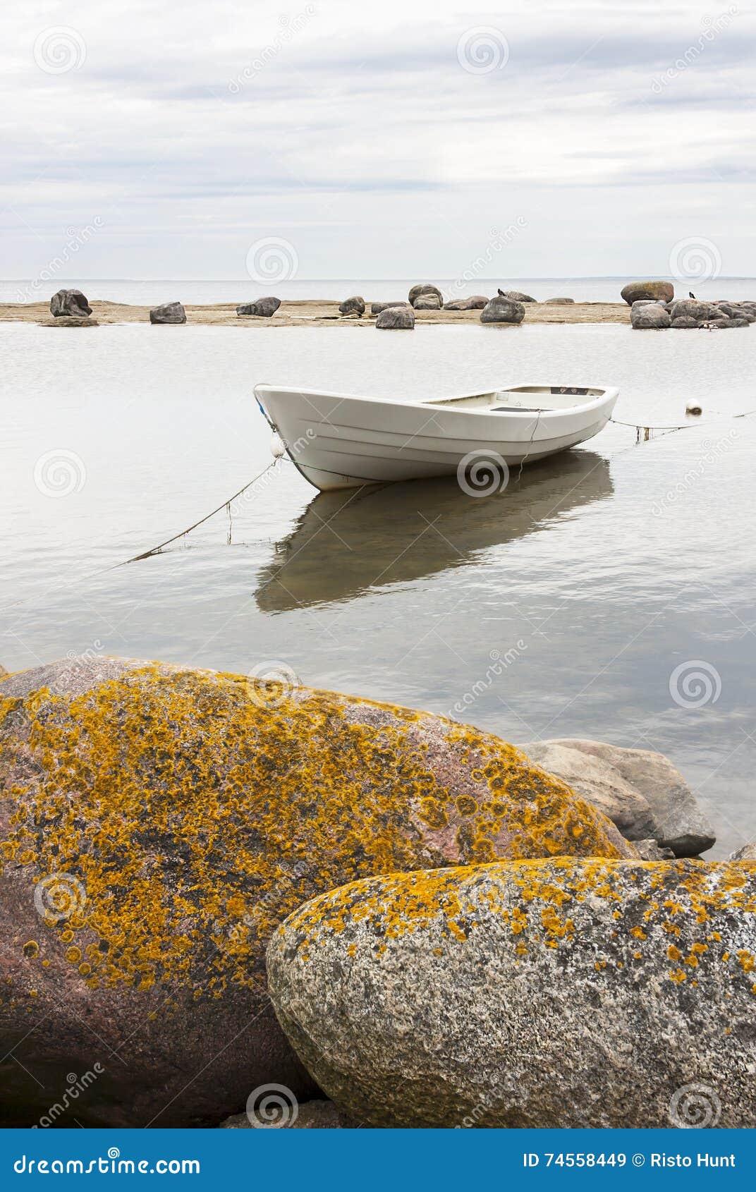 White boat behind rocks stock image. Image of transportation - 74558449