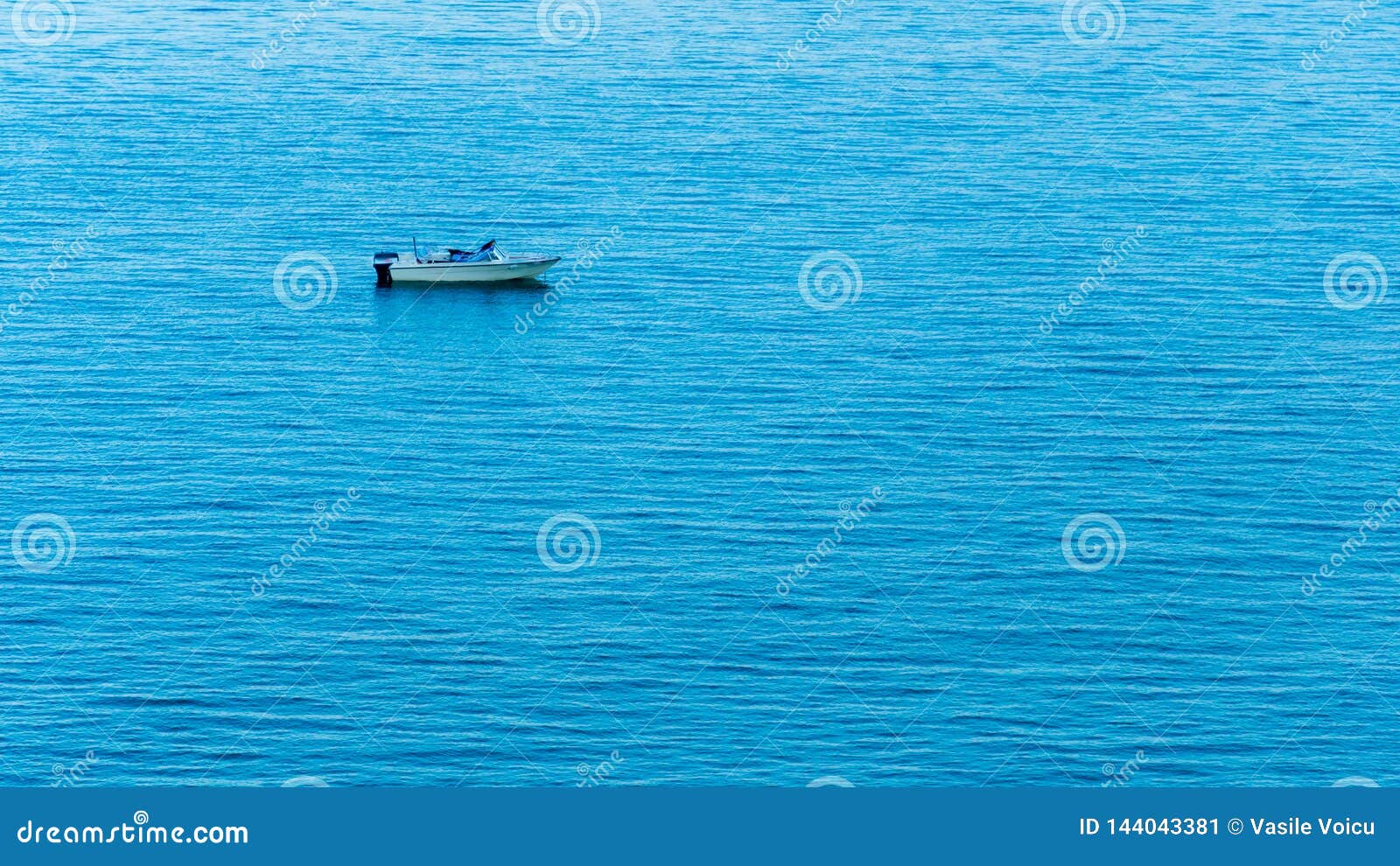 A White Boat Isolated in the Middle of the Blue Sea Stock Image - Image ...