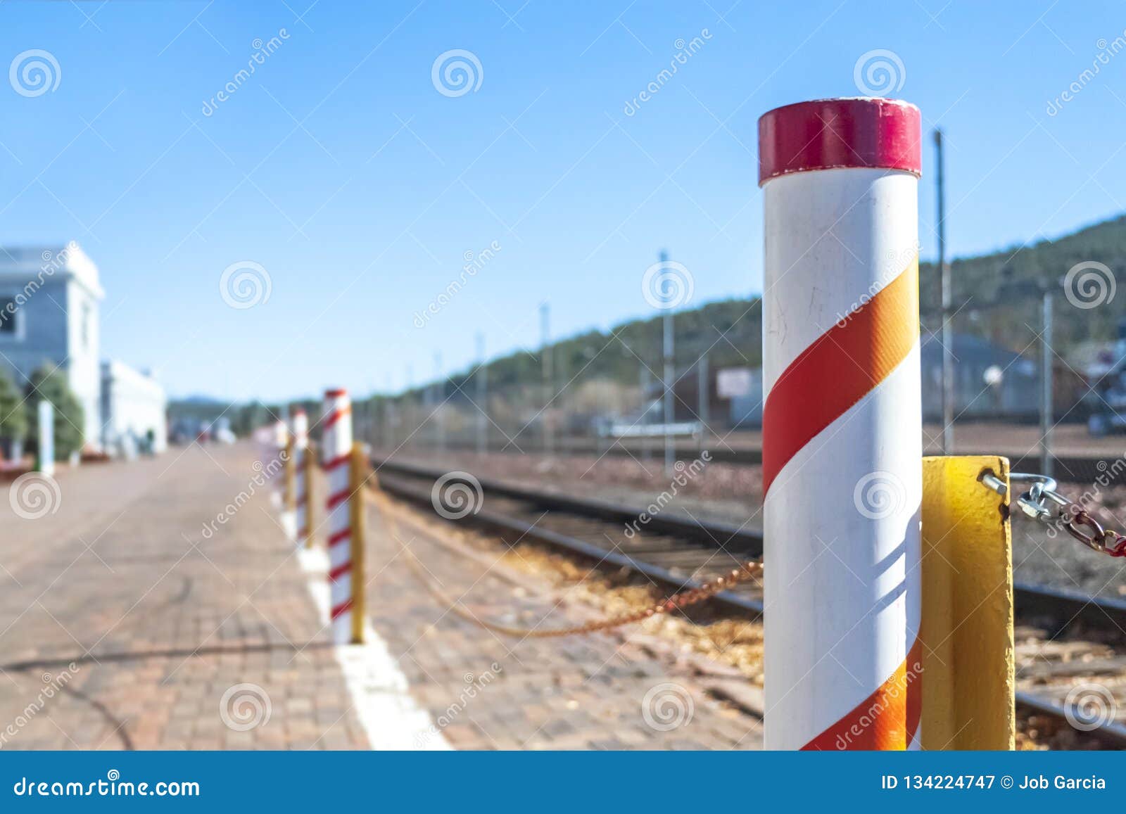 White Bollard Post with Train Tracks Stock Image - Image of post ...