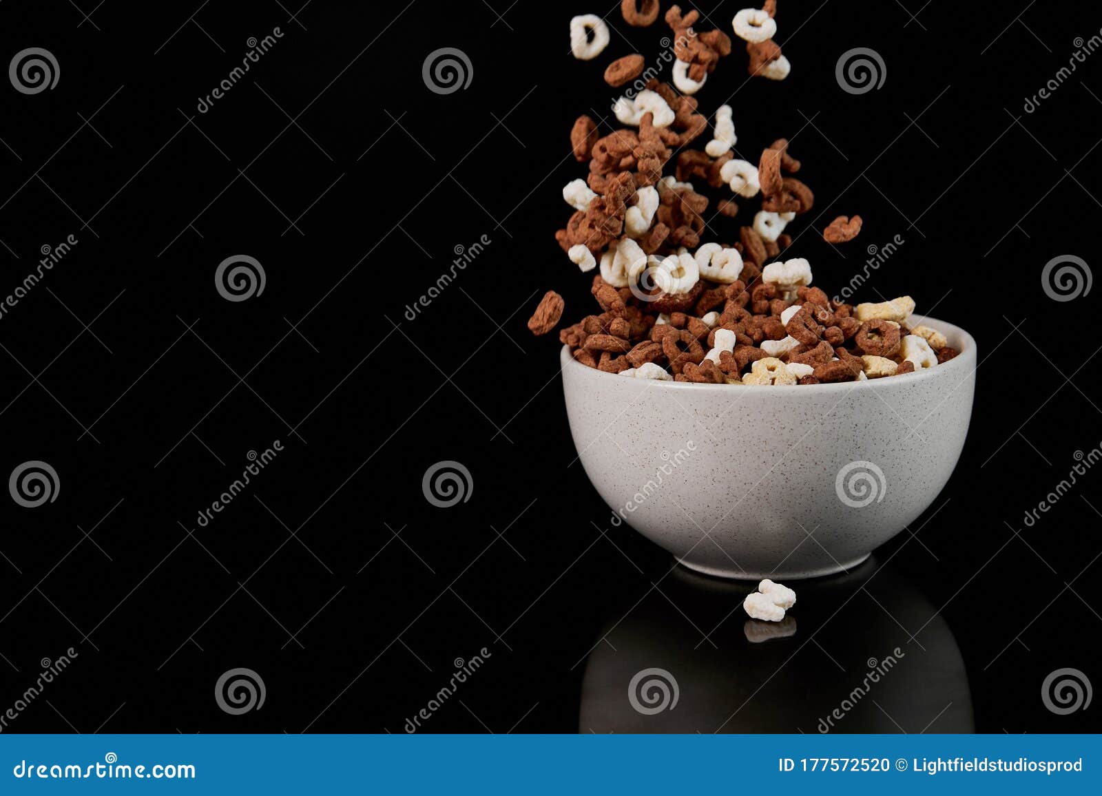 Bowl with Fallen Cereal Pieces Isolated Stock Photo - Image of fallen ...