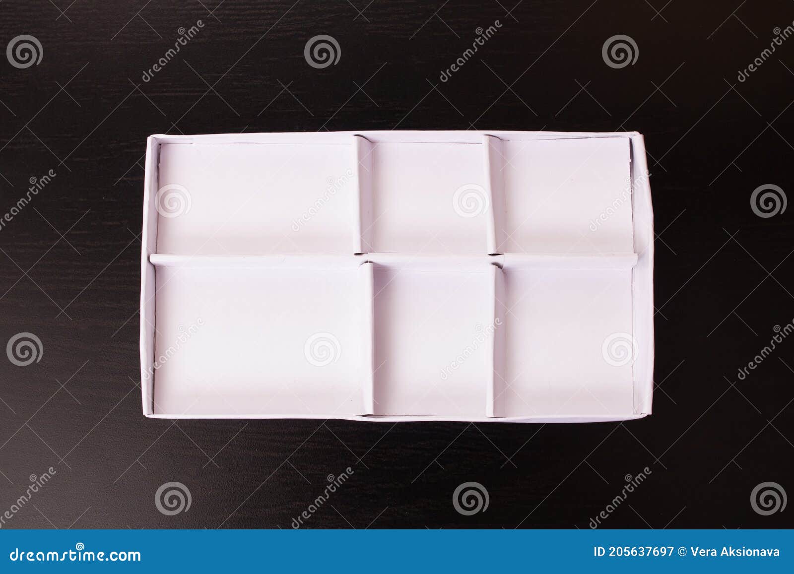 White Box with Cells on Wooden Table Stock Image - Image of table ...