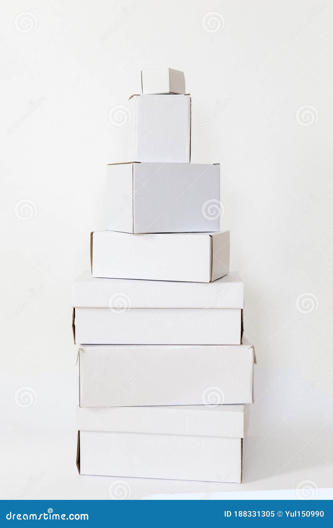 Isolated White Boxes of Different Size Standing on Each Other As a High ...