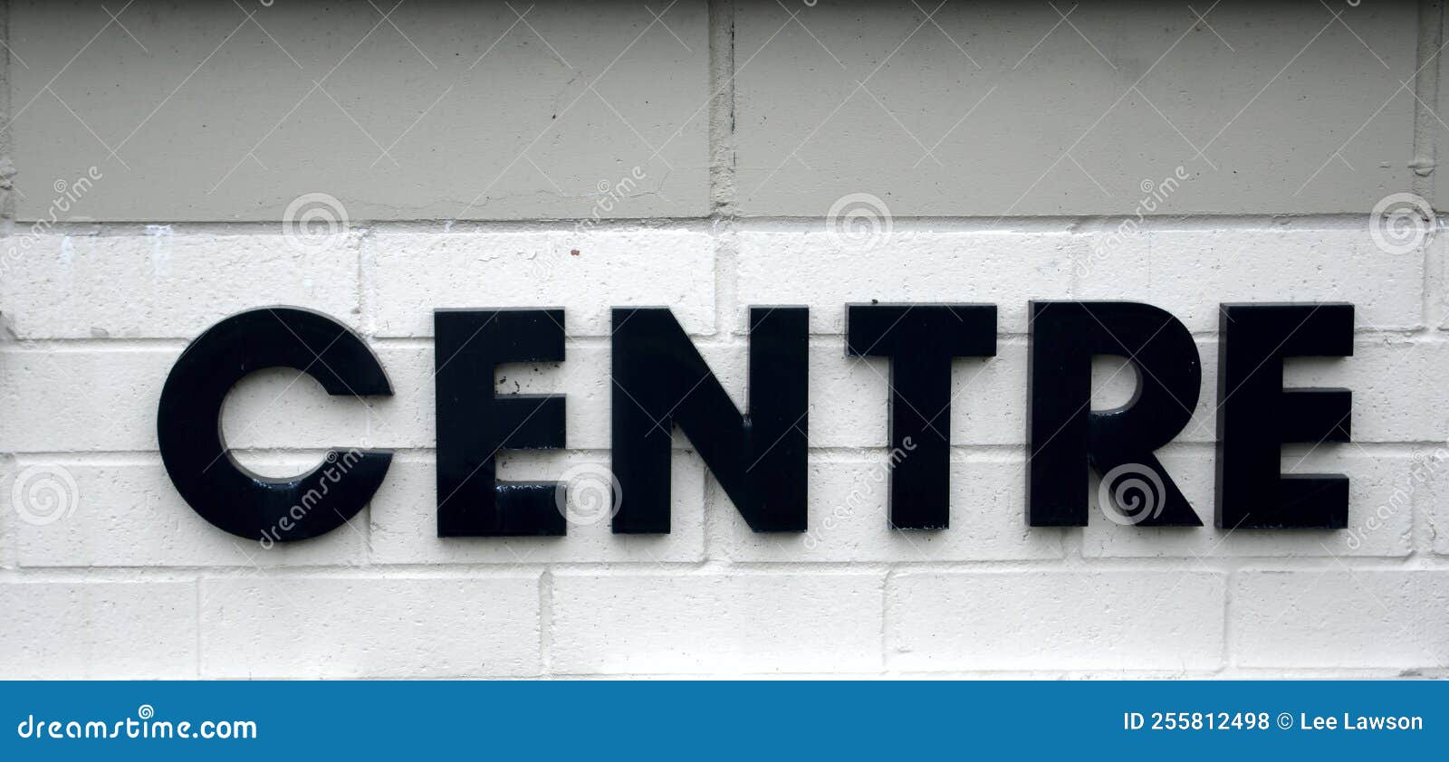 Centre Lettering on while Brick Wall Stock Photo - Image of blue ...