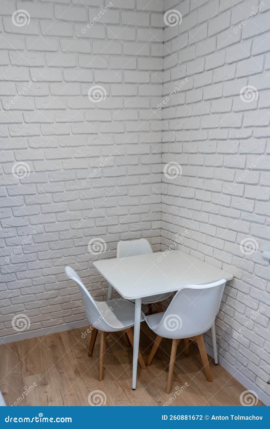 White Brick Wall with Table in Corner of Kitchen Stock Photo - Image of ...