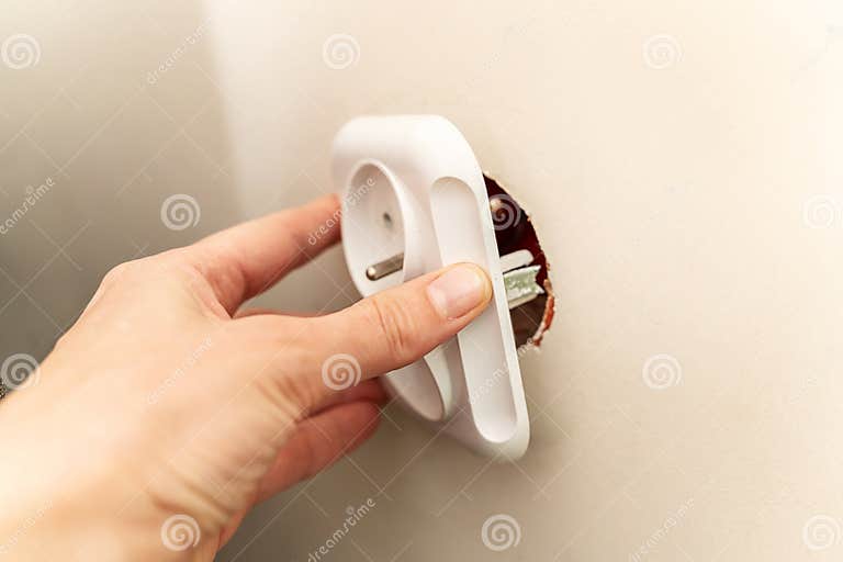 White Broken Electrical Socket Fell Out of the Wall. the Socket is Torn ...