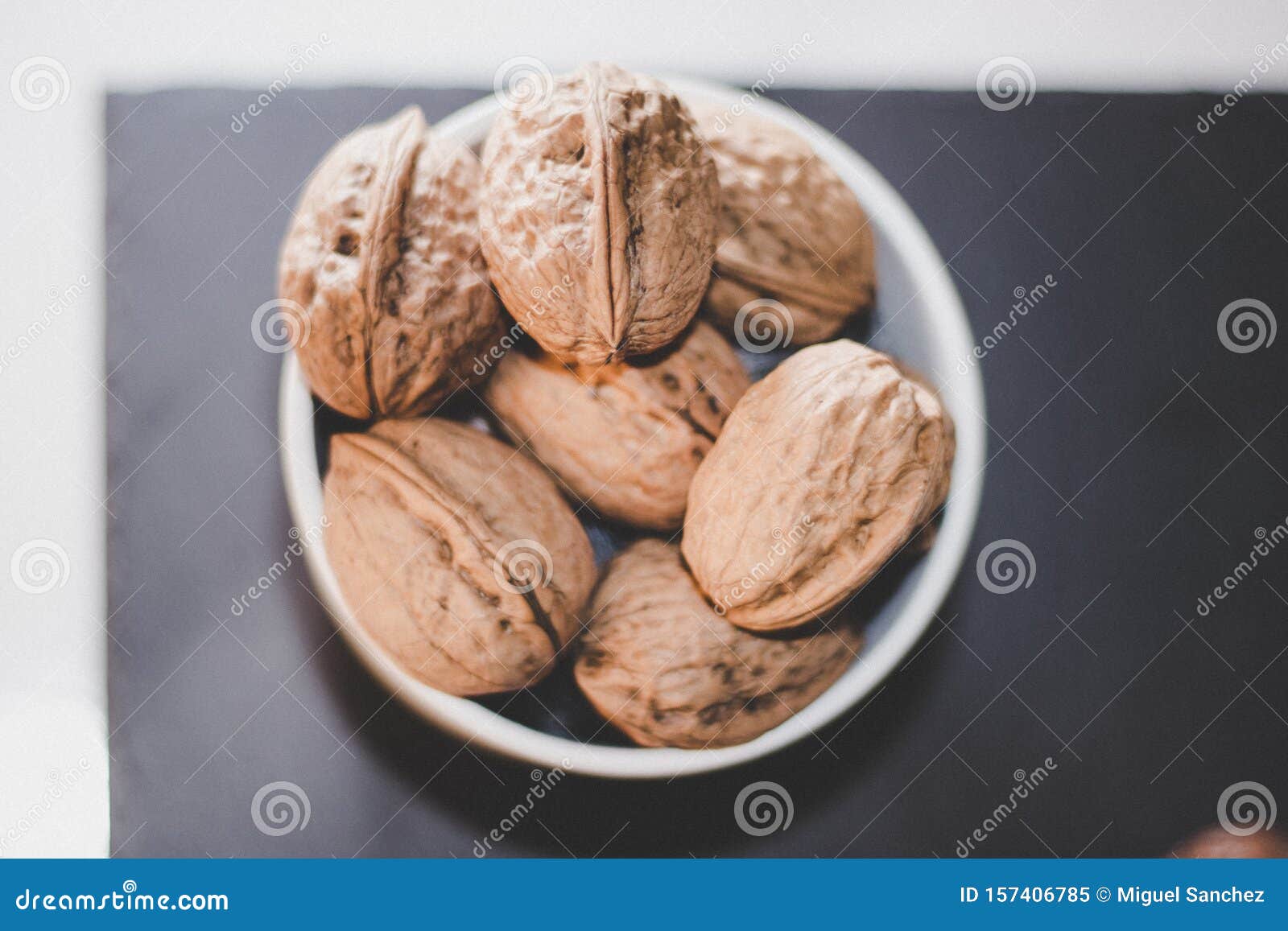 White Bucket Full of Nuts on Black Background Stock Image - Image of ...