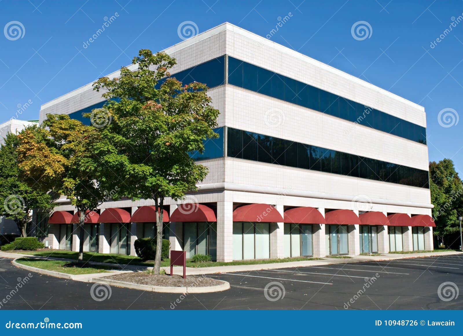White Building and Red Awnings Stock Photo - Image of cement, building ...