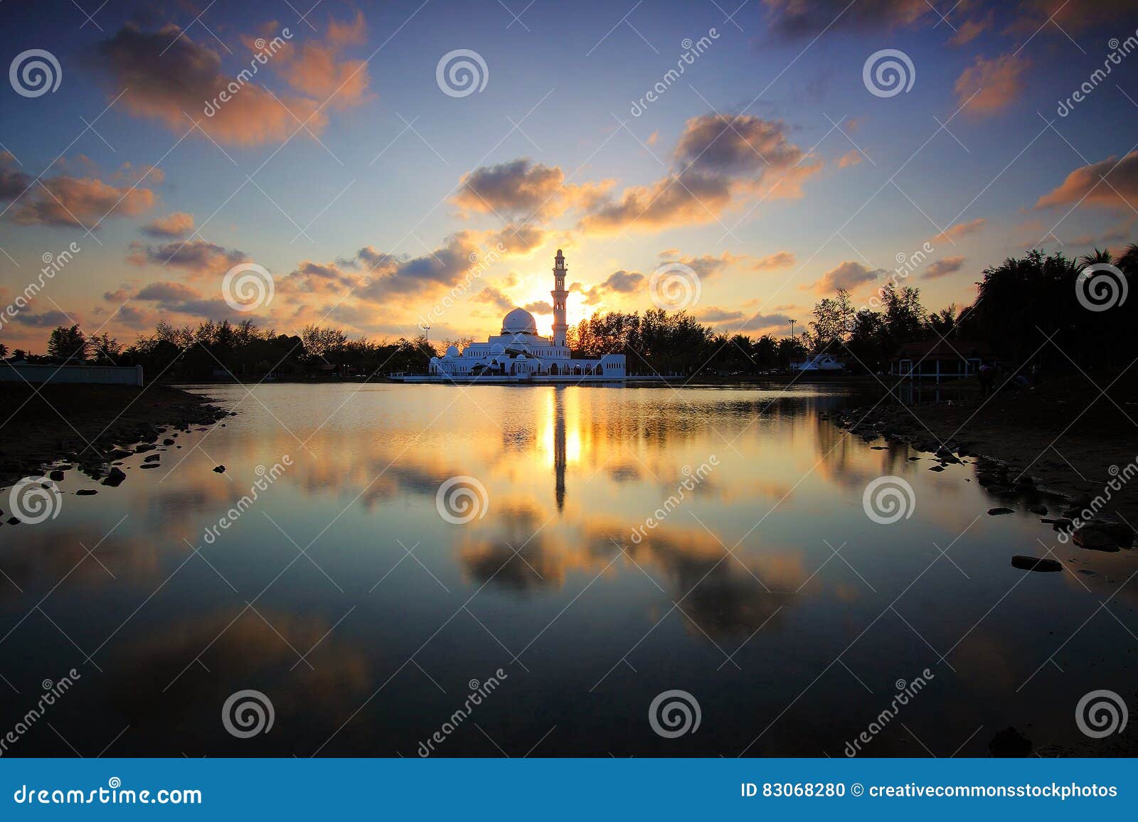 White Building Surrounded By Water And Trees During Golden Hour Picture ...