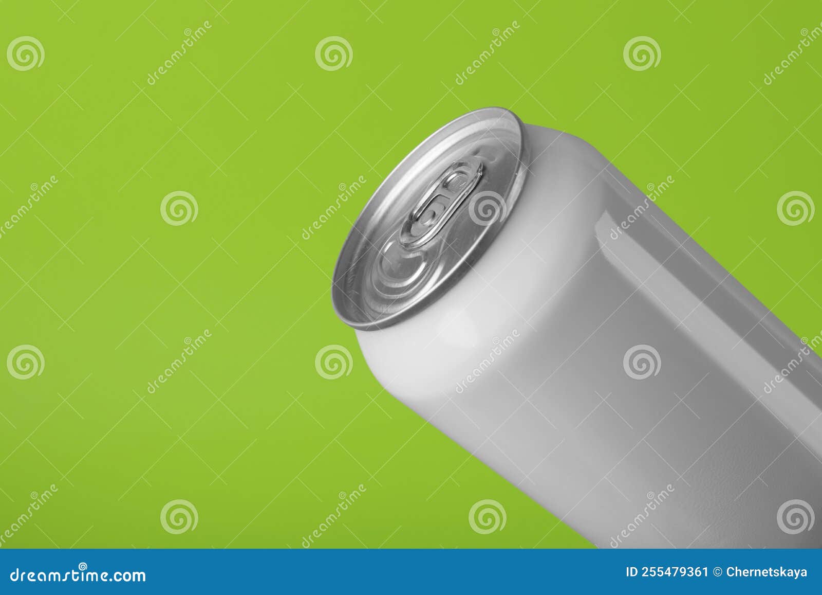 White Can of Energy Drink on Light Green Background, Closeup. Space for ...