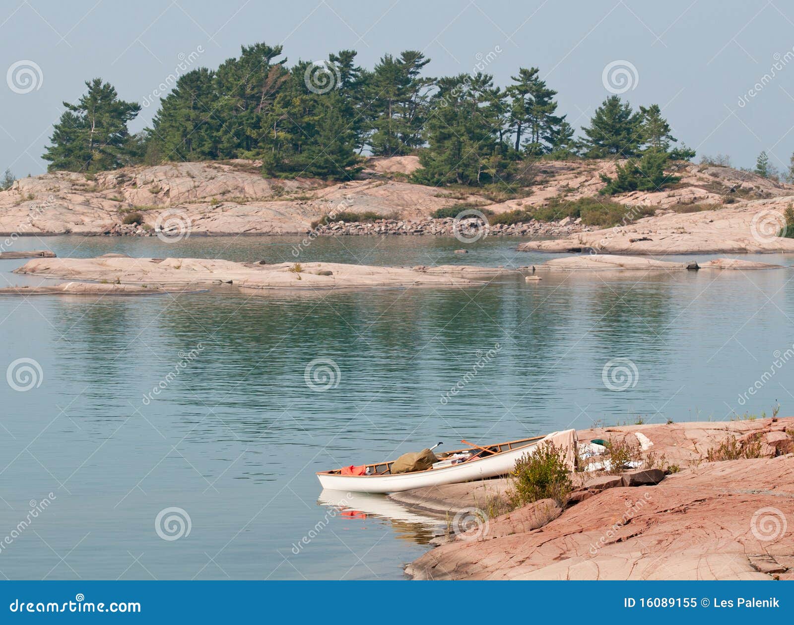 White canoe on a pink rock stock image. Image of ragged - 16089155