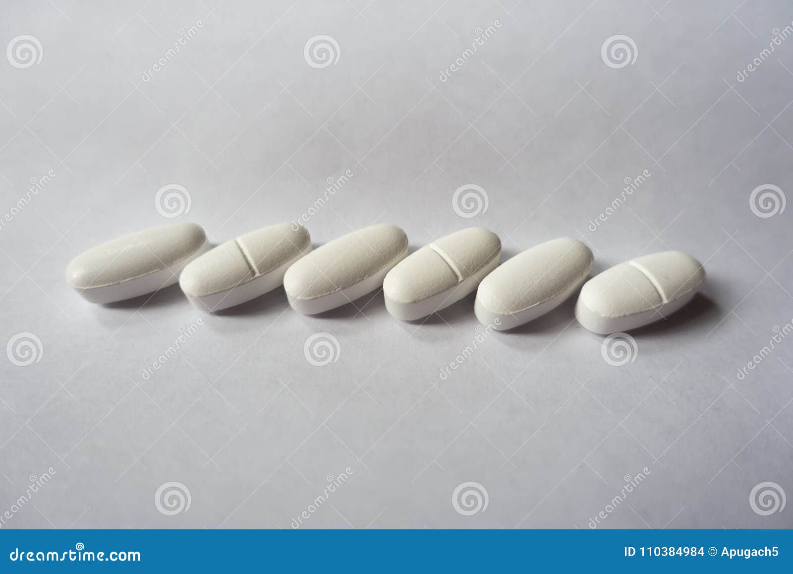 White Caplets of Calcium in a Row Stock Photo - Image of biotechnology ...