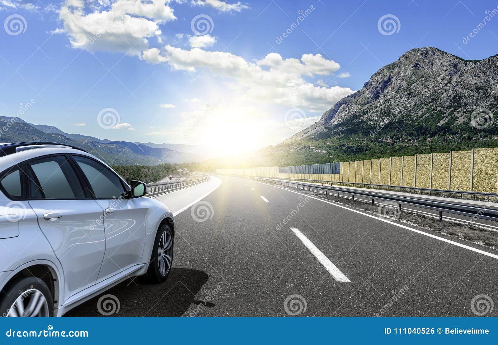A White Car Rushing Along a High-speed Highway in the Sun. Stock Photo ...