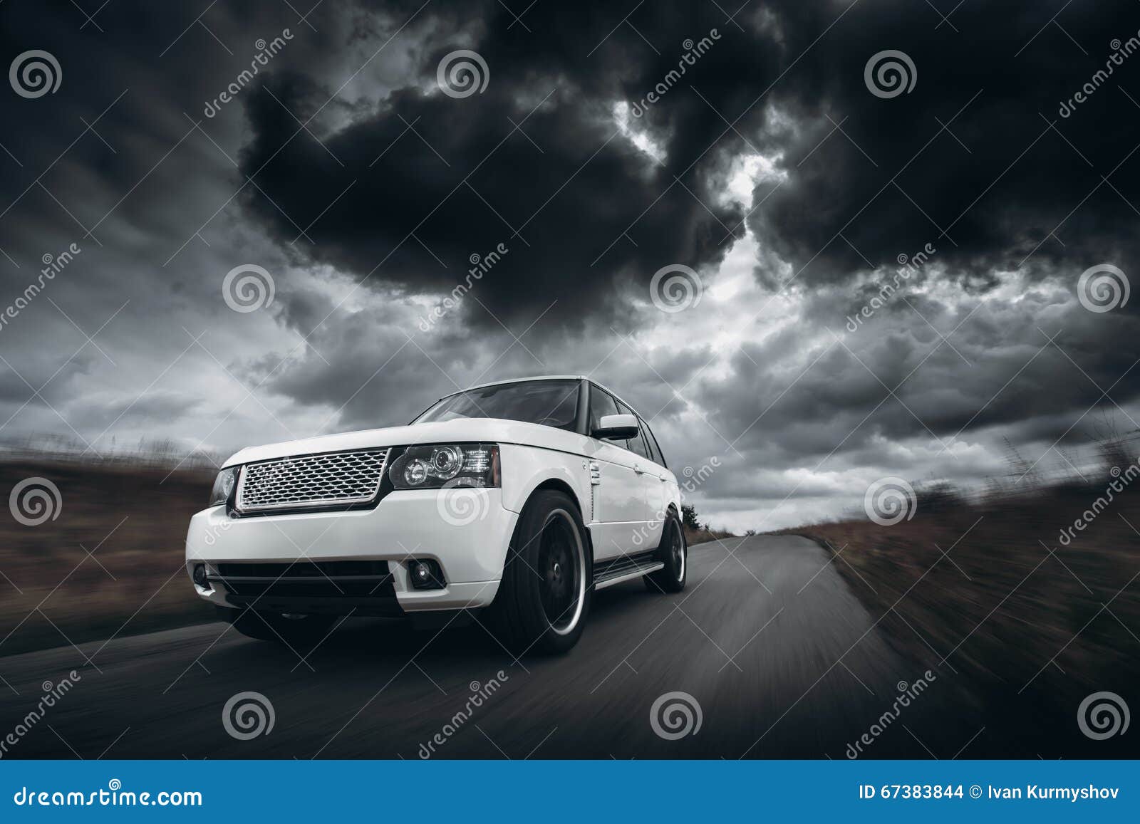 White Car Speed Driving on Road at Dramatic Clouds Daytime Stock Photo ...