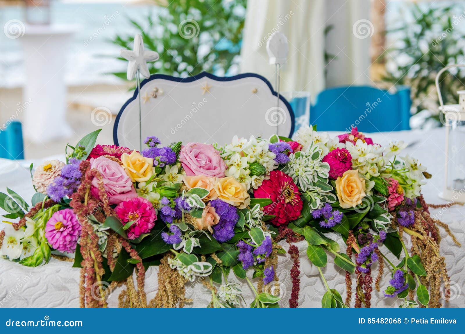 A White Card Just Married Sign on Table with Flowers at a Wedding Stock ...