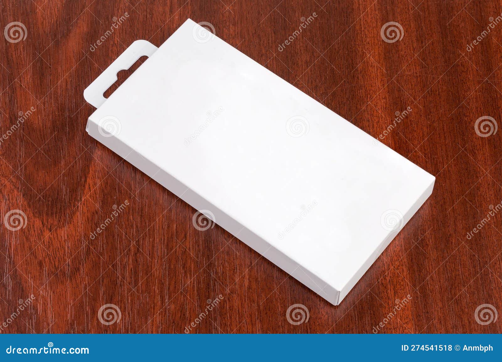 White Cardboard Hang Tab Packing Box on a Wooden Table Stock Photo ...