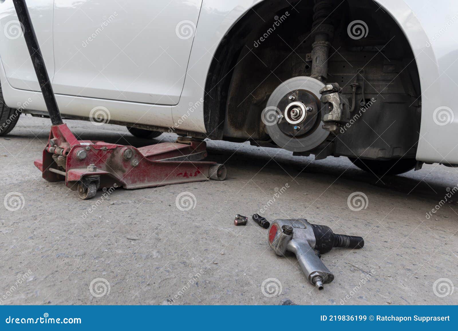 White Cars Change Wheels Using a Lifting Jack Stock Image - Image of ...