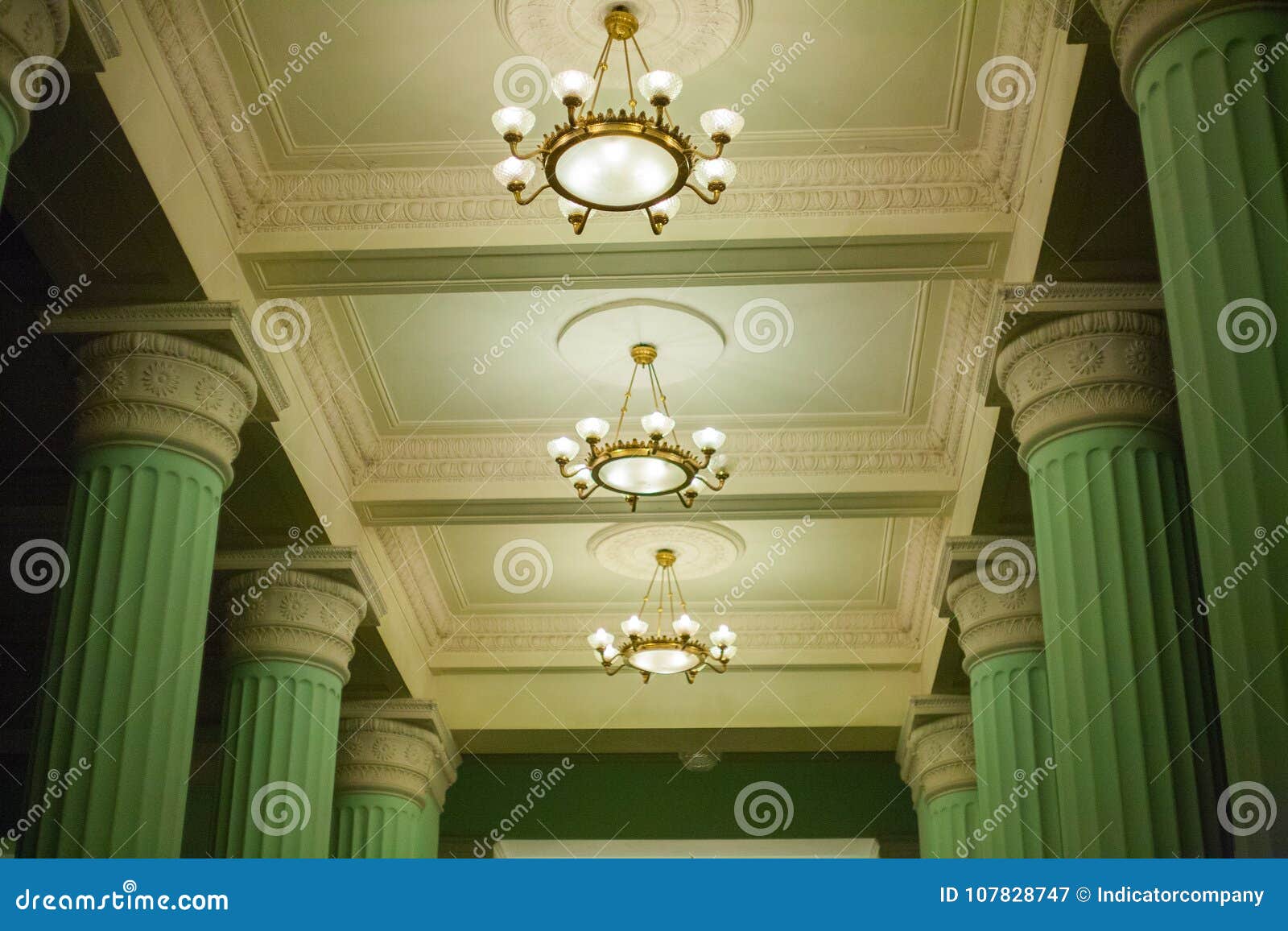 White Ceiling with Large Chandeliers and Green Columns of Classical ...