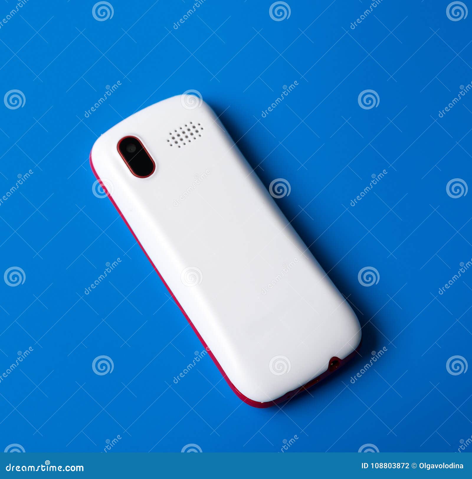 White Cell Phone on Blue Background. Rear View. Stock Photo - Image of ...