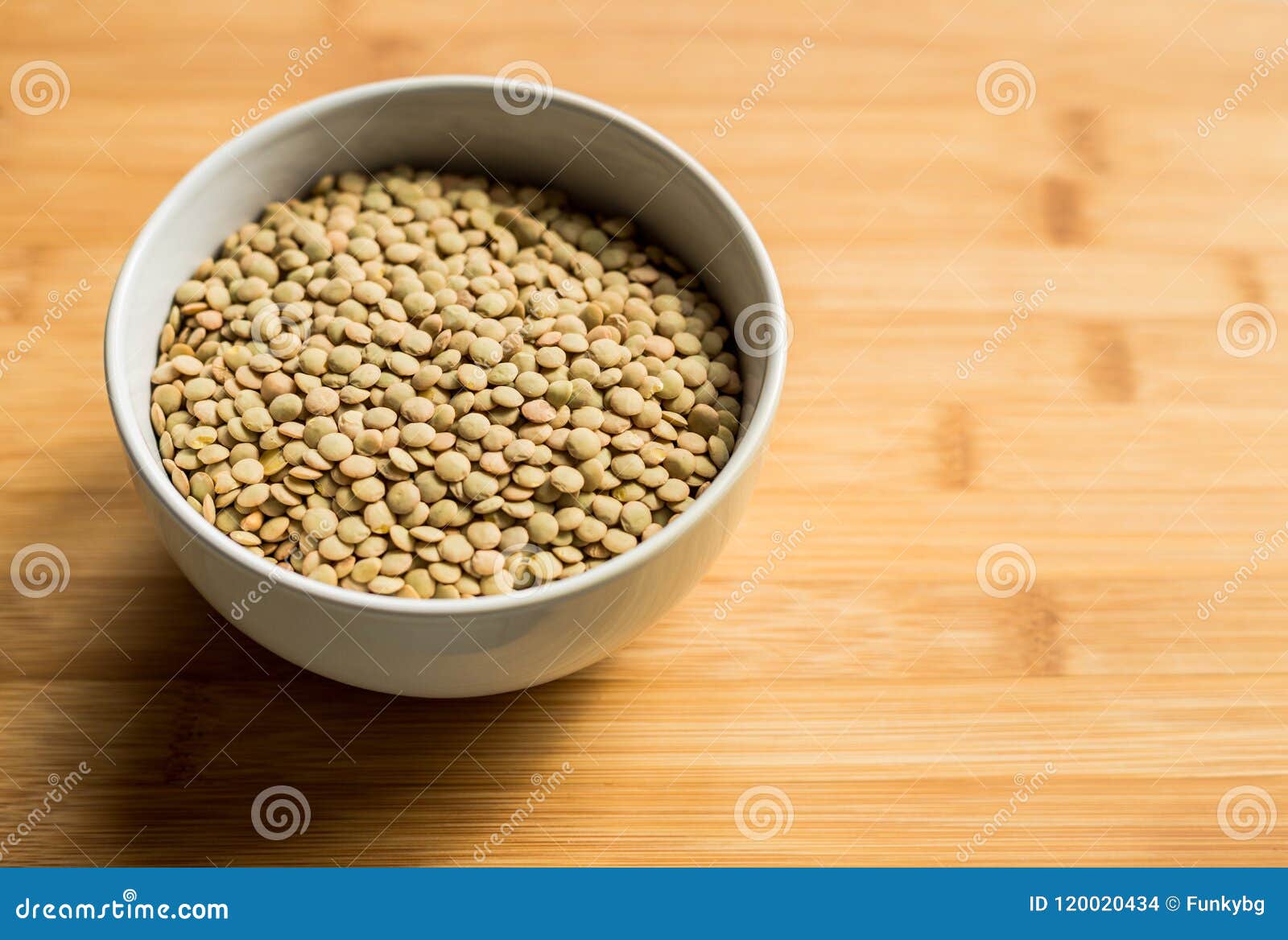 White Ceramic Bowl of Green Uncooked Lentils Stock Photo - Image of ...