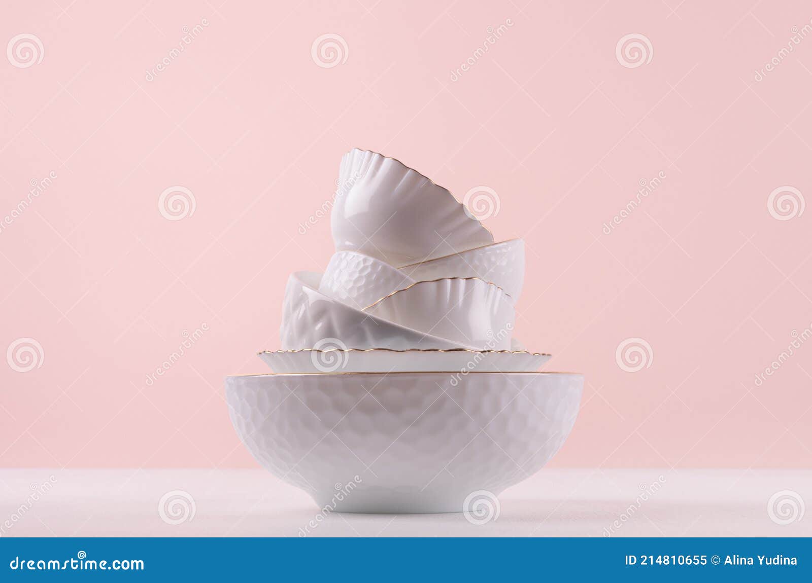 White Ceramic Crockery Stack with Golden Bezel, Different Texture on ...