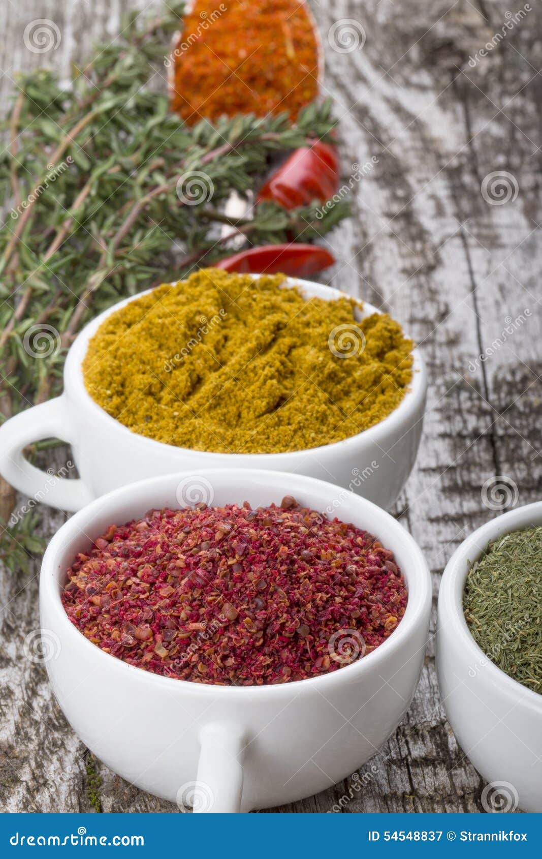 White Ceramic Cups with Different Kinds of Spices on Old Wooden Stock ...