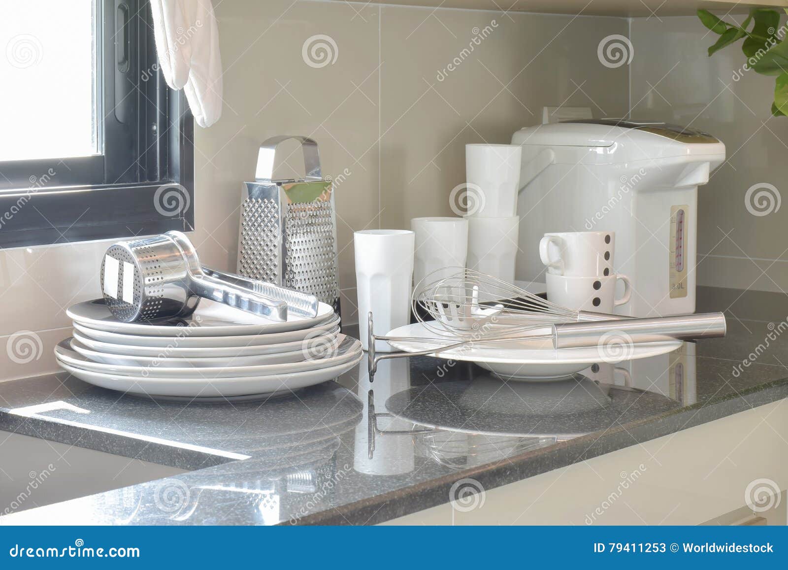 White Ceramic Set and Stainless Kitchen Utensils on the Counter Stock ...