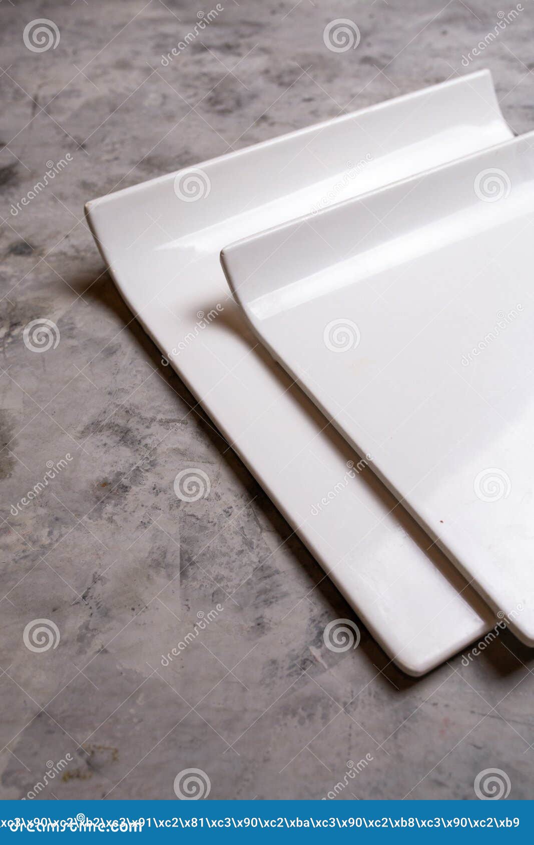 White Ceramic Square Plates on a Concrete Background Stock Image ...