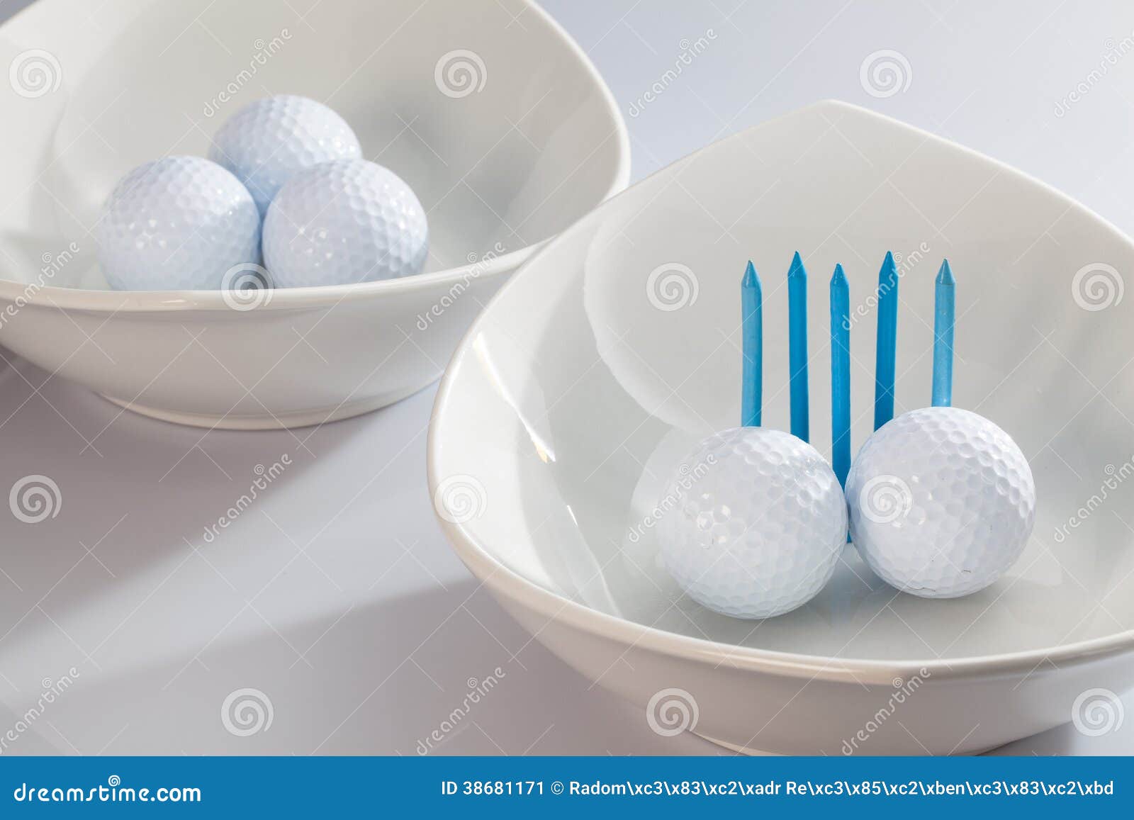 White Ceramics Bowls and Golf Balls Stock Image - Image of color ...