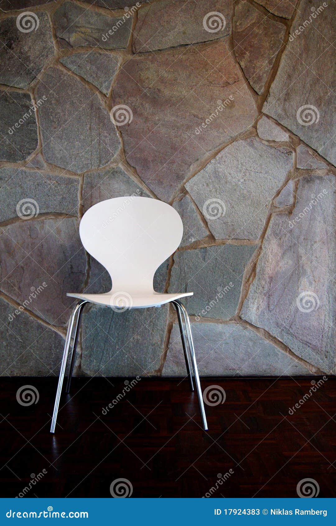 White Chair by stone Wall stock image. Image of design - 17924383