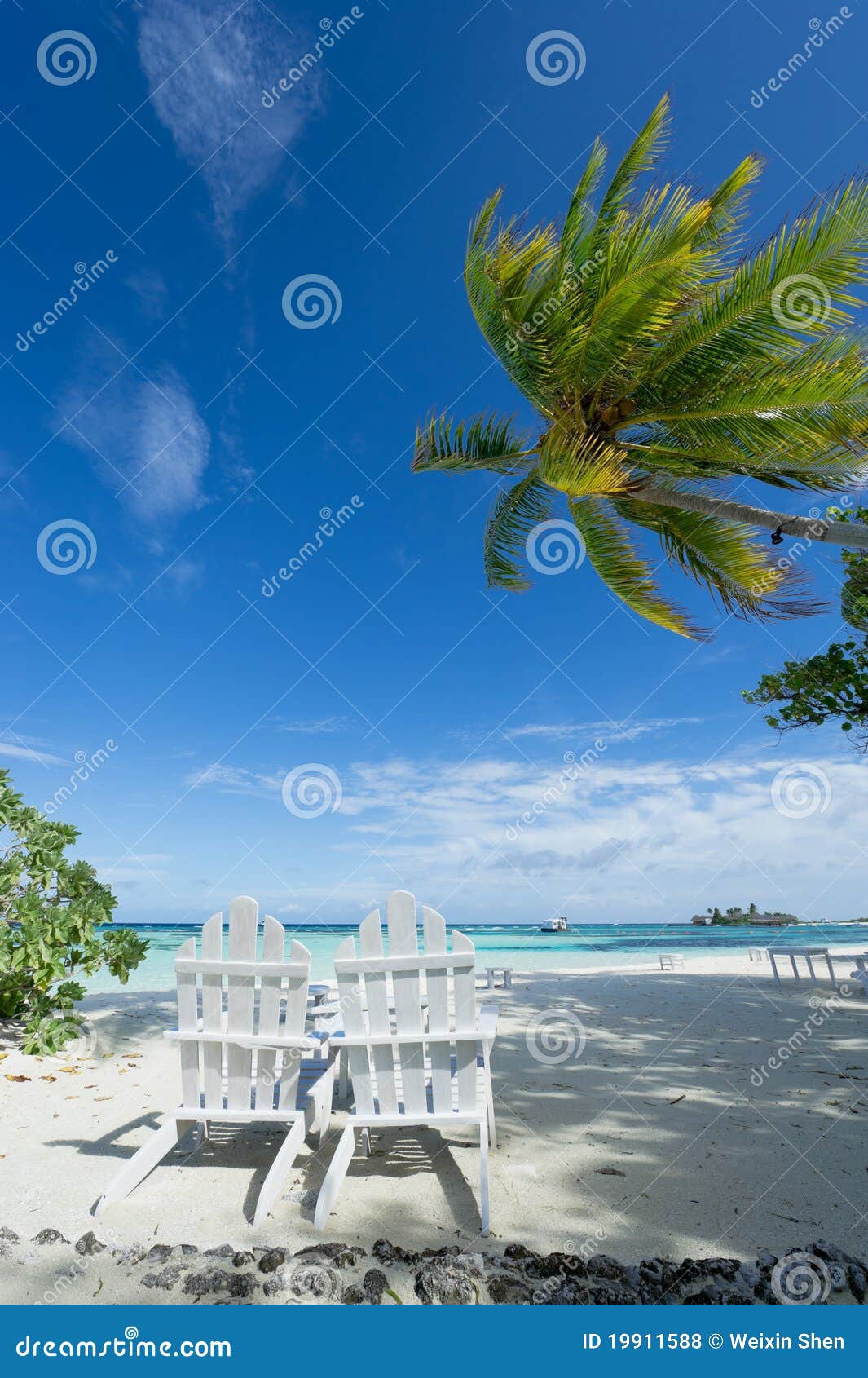 White chairs on the beach stock photo. Image of blue - 19911588