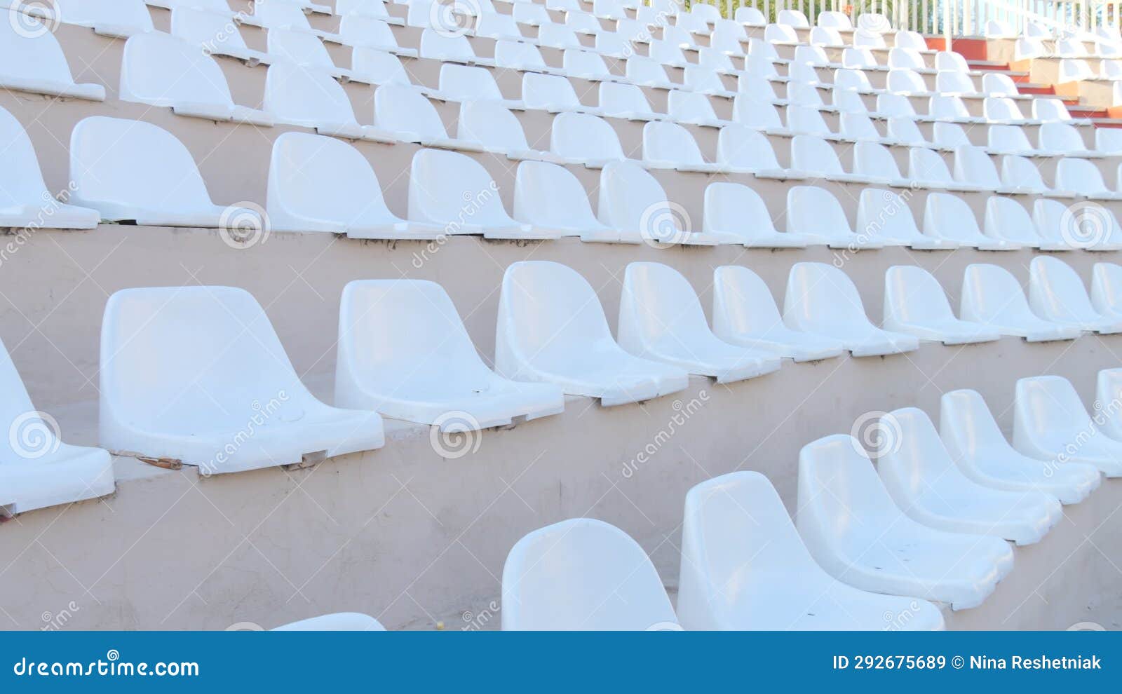 White Chairs of an Empty Amphitheater or Stadium Under the Open Sky. a ...