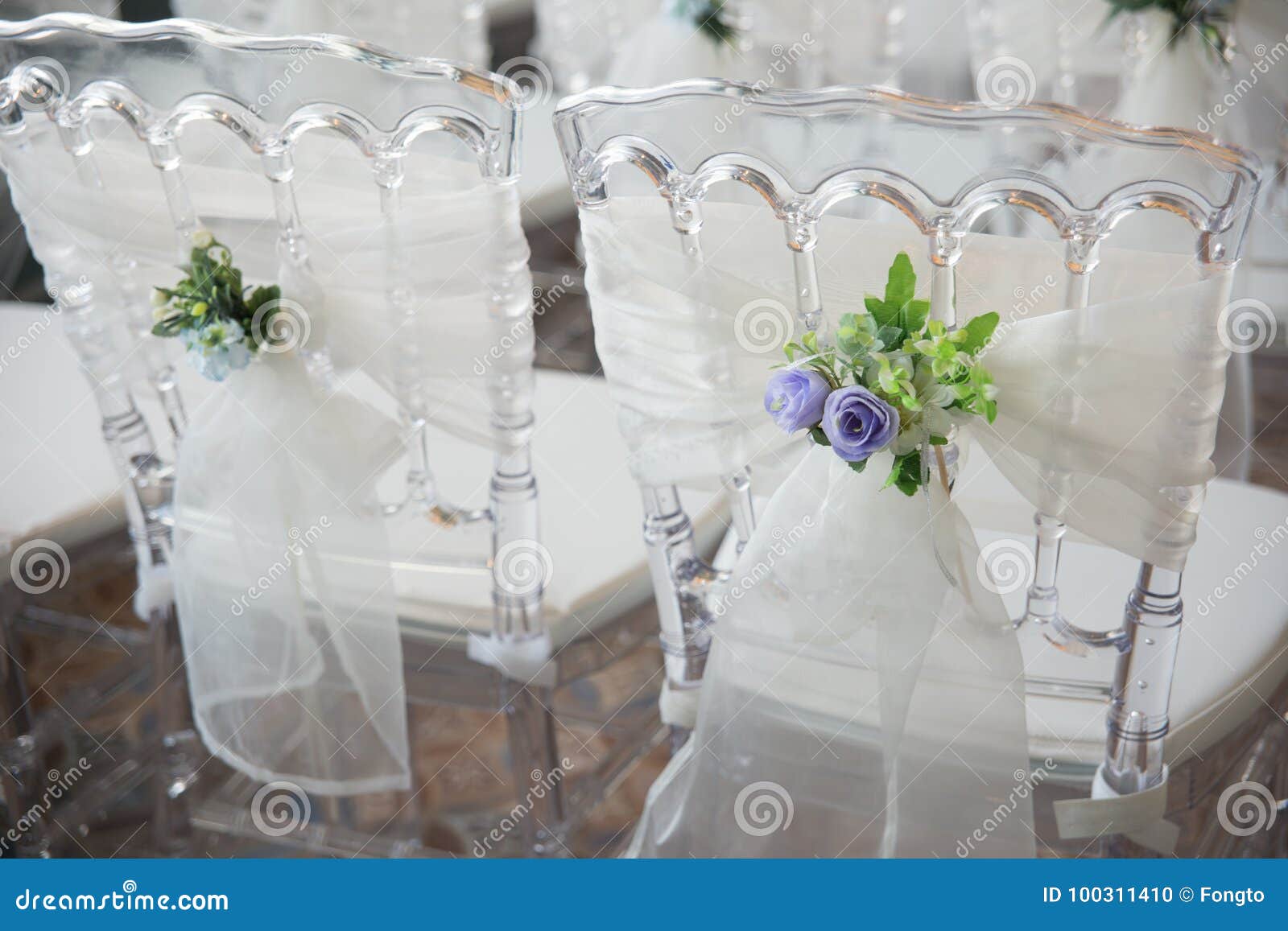 White Chairs with Flowers for a Wedding Ceremony. Stock Photo - Image ...