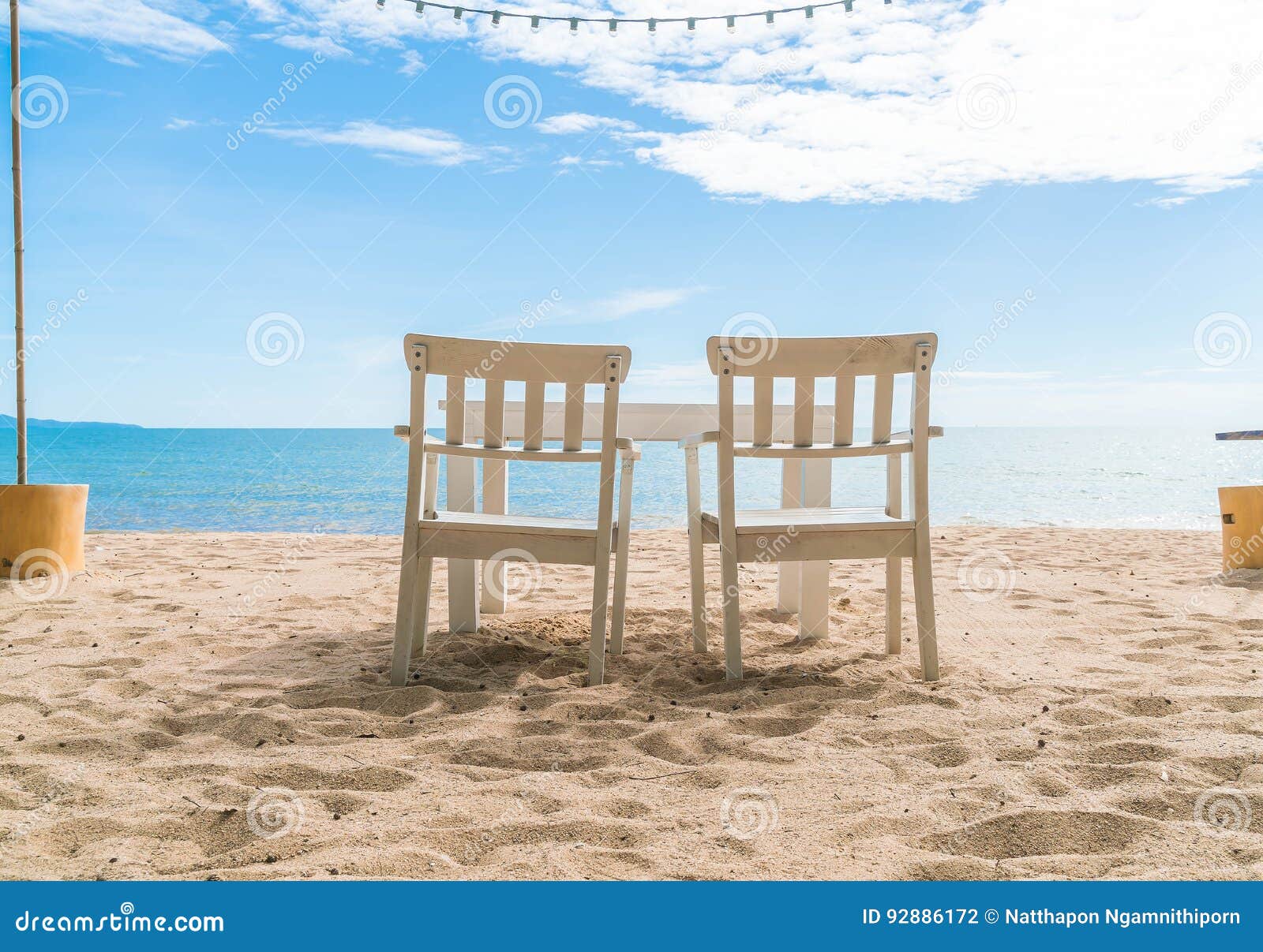 White Chairs and Table on Beach Stock Photo - Image of beautiful ...