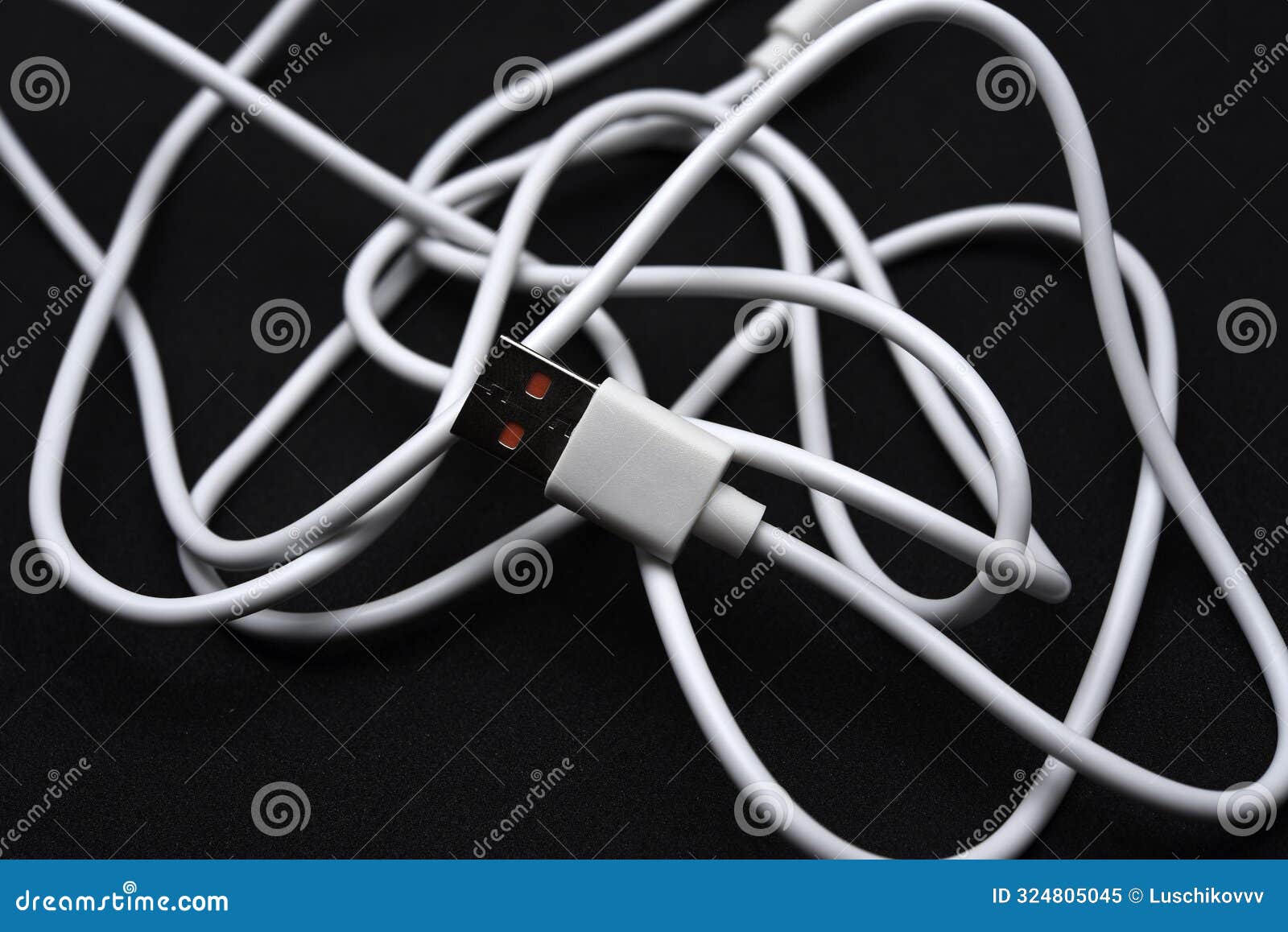White Charging Cable on a Black Background. USB Cable Stock Image ...