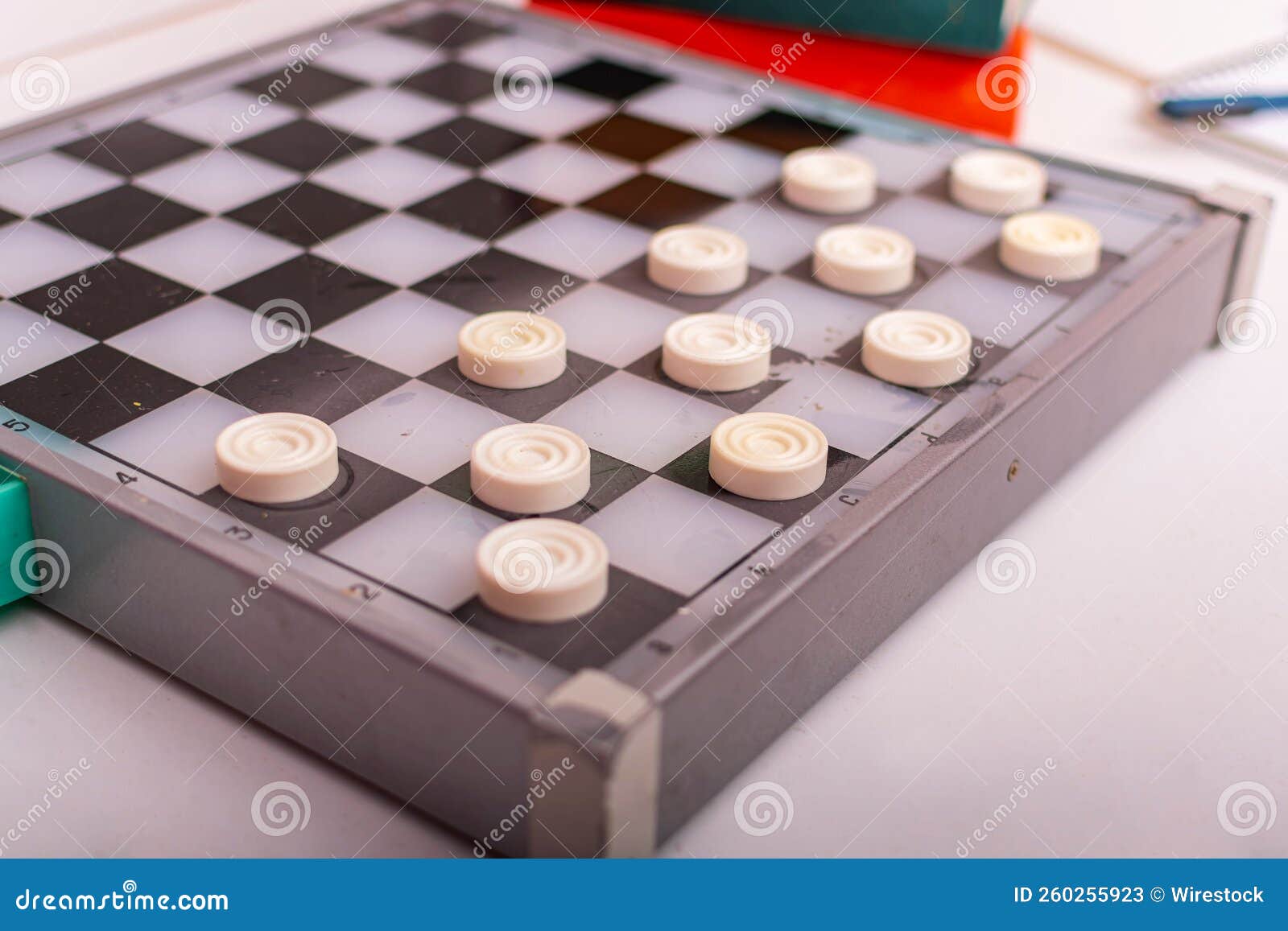 White Checkers are Placed on Game Chessboard. Getting Ready for New Set ...