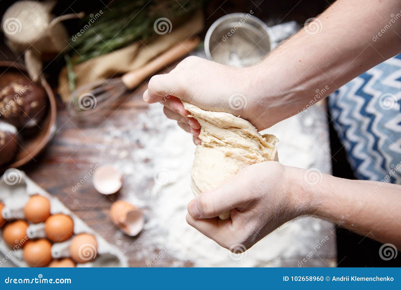 The Chef Tears the Dough Over the Table. View from Above. Stock Photo ...