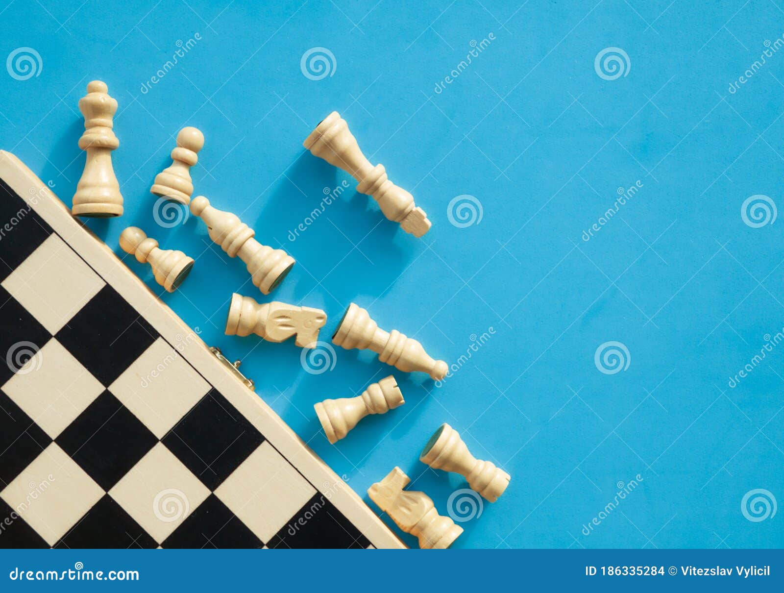 Game Over. White Chess Pieces Lying Next To a Chessboard Stock Photo ...