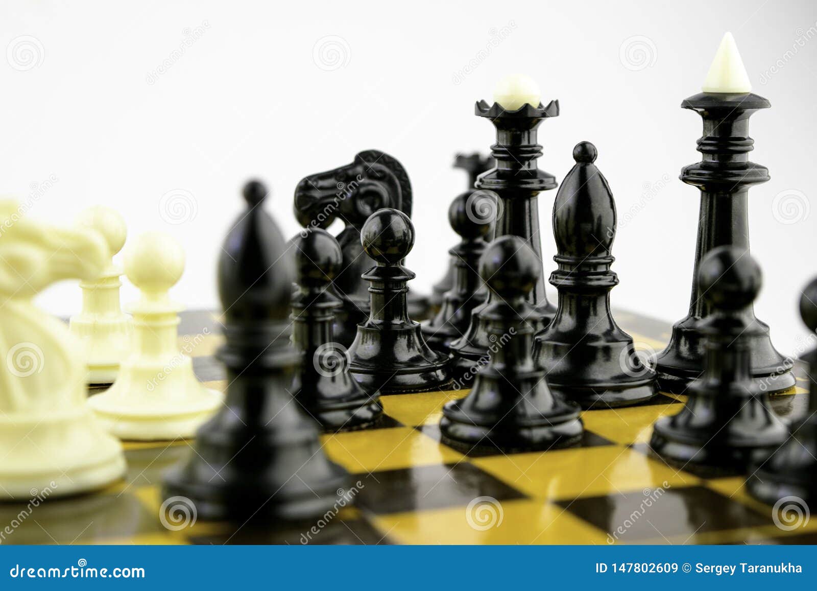 White Chess Pieces Stand on a Chessboard during a Game of Chess, Focus ...