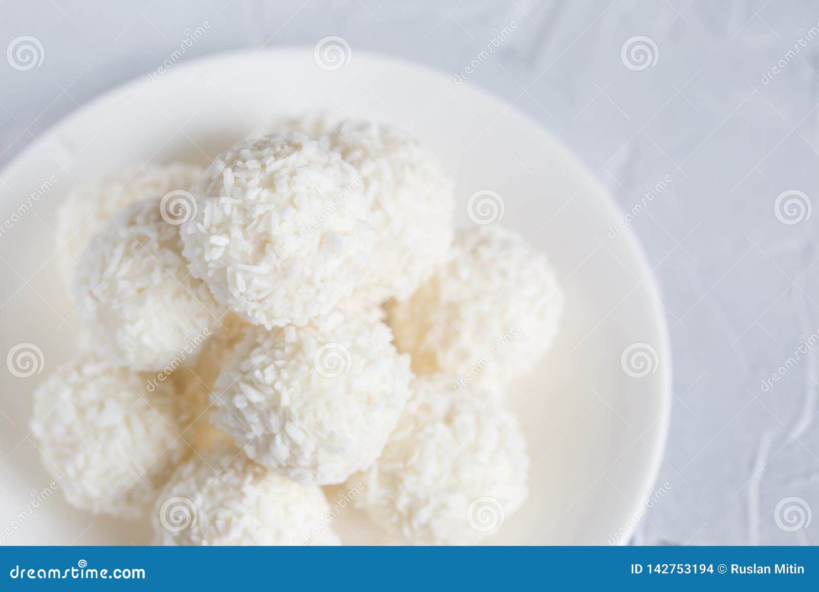 Round, White Candies in Coconut Flakes Stock Photo - Image of ...