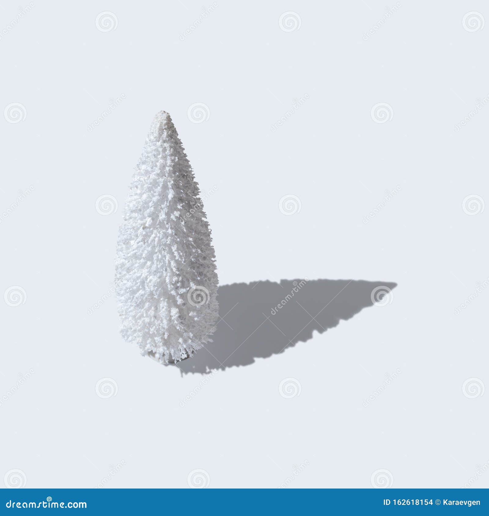White Christmas Tree with Strong Shadows on White Background. Creative ...