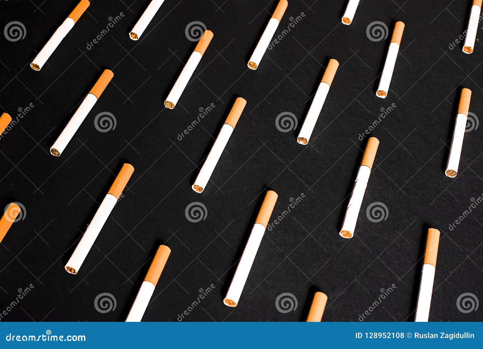 White Cigarettes with Orange Filter Lined in a Row in Order Stock Photo ...