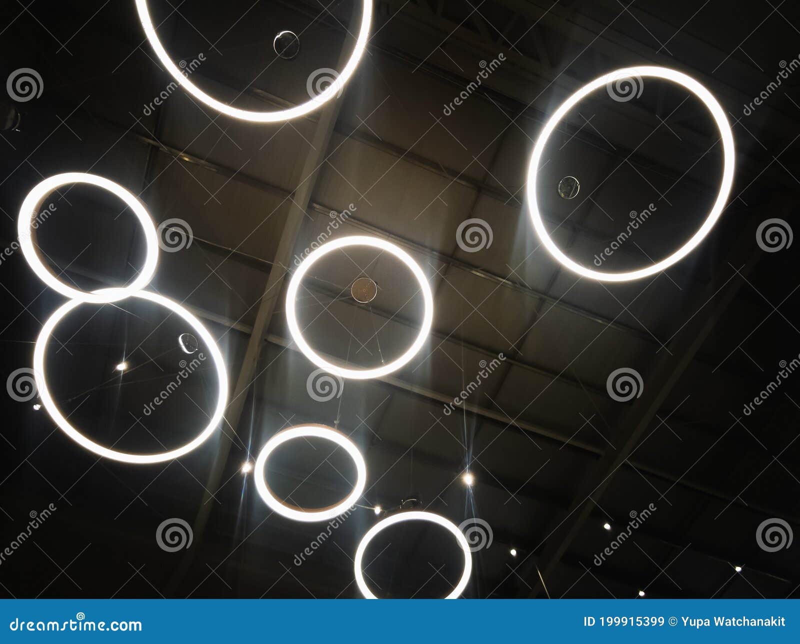 White Circular Ring Shaped Lamps Hang Under a Concrete Ceiling Stock ...